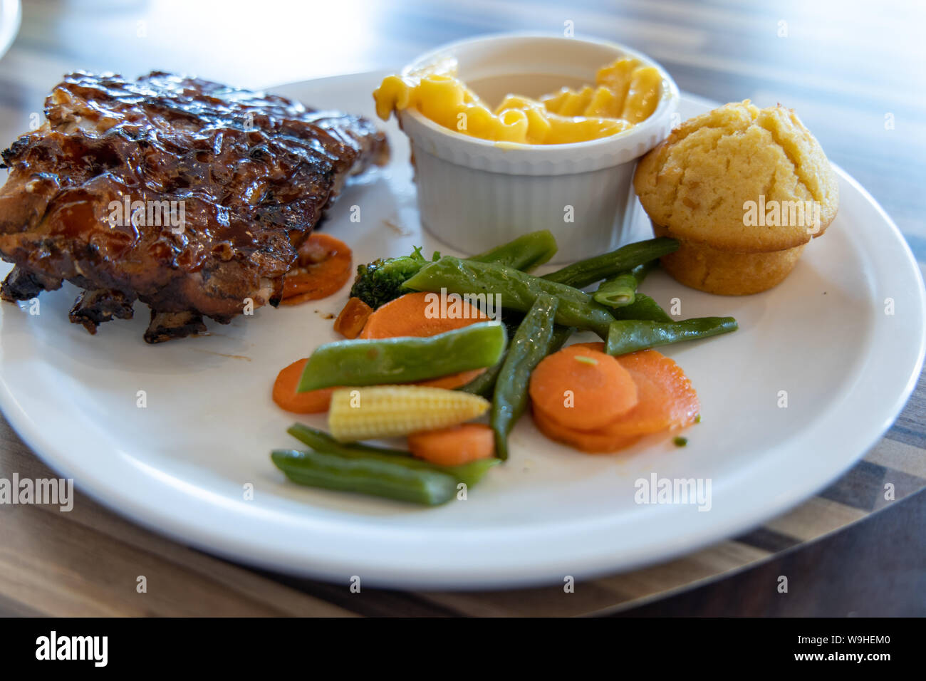 grilled pork lib with vegetable on the plate Stock Photo - Alamy
