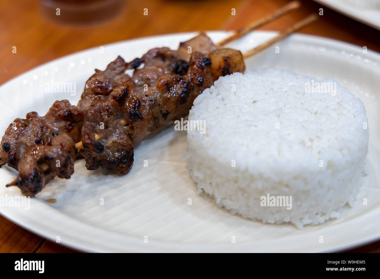 pork barbecue with rice on the plate Stock Photo - Alamy