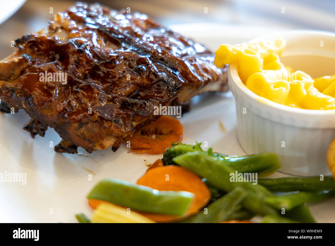 grilled pork lib with vegetable on the plate Stock Photo - Alamy