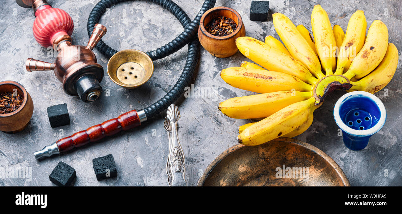 Tobacco shisha with banana aroma.Kalian with banana Stock Photo - Alamy