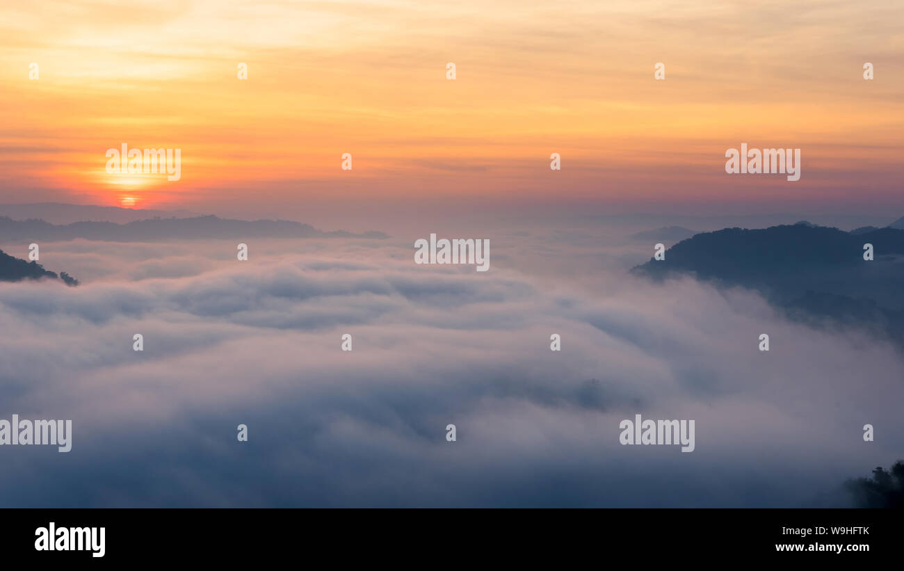 Panorama view of amazing mist moving over the nature mountains during ...