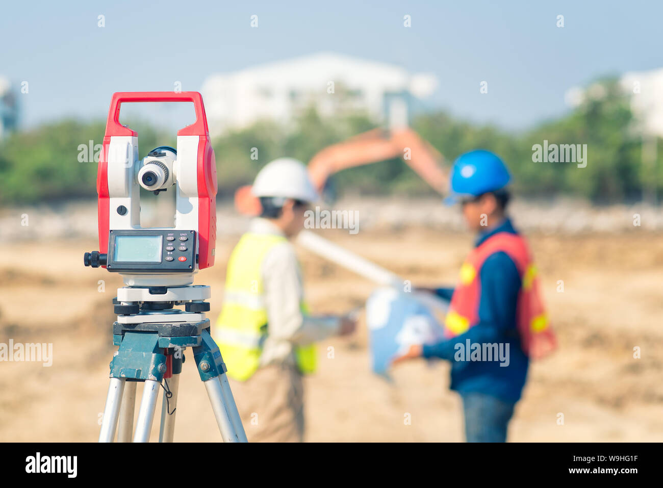 Asian construction engineer checking construction drawing for new ...