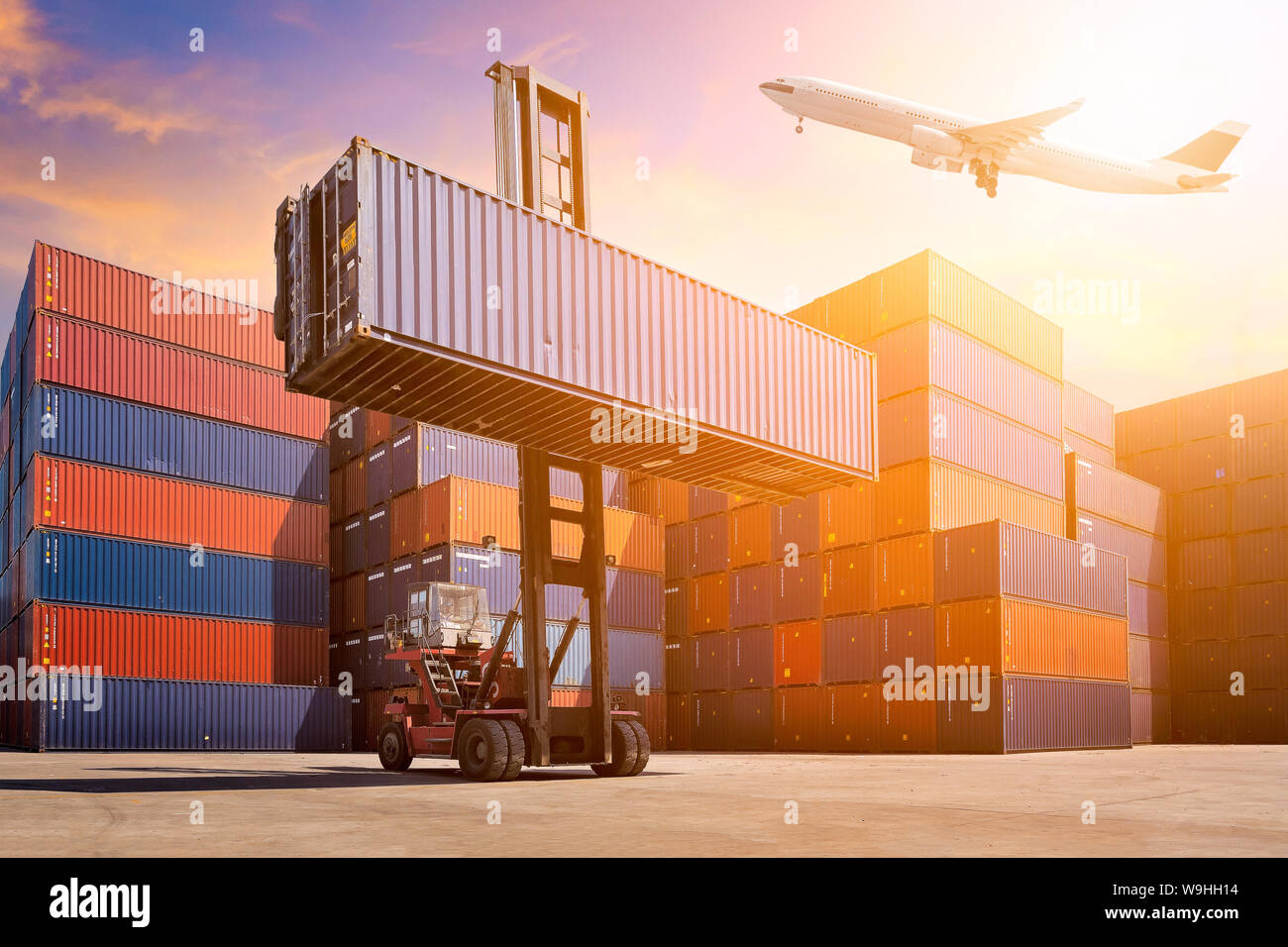 Flight cargo flying over Logistic cargo container in shipping yard ...
