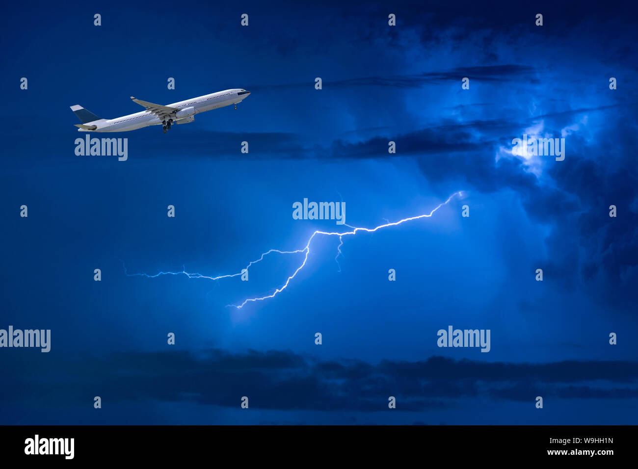 Commercial airplane take off flying over storm clouds and lightning ...