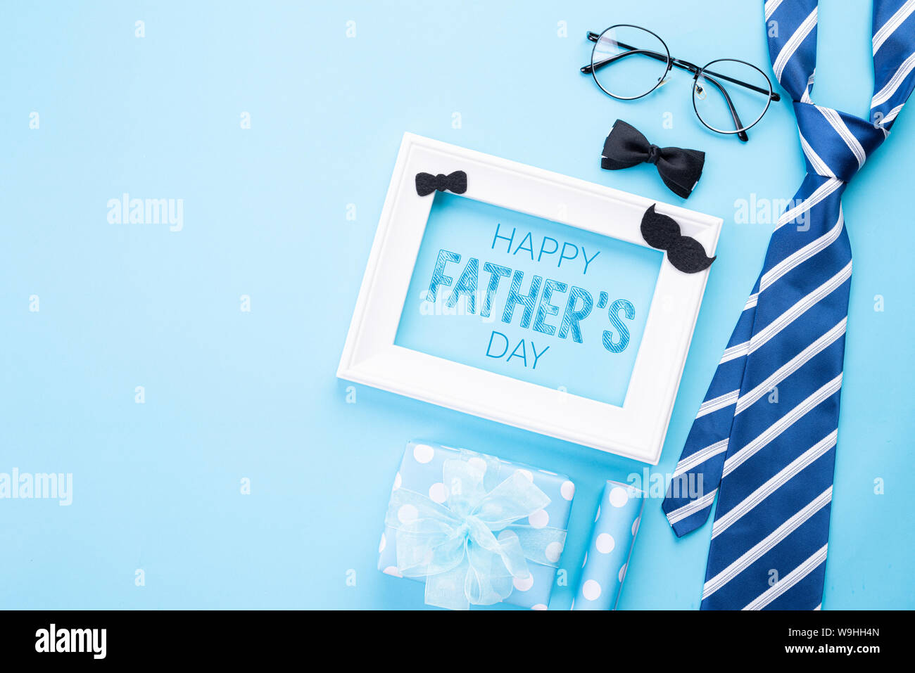 Happy fathers day concept. Top view of blue tie, beautiful gift box ...