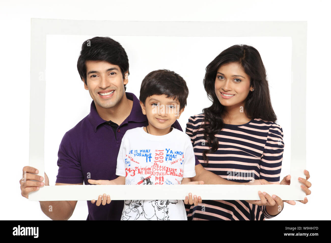 Family looking through empty frame Stock Photo - Alamy