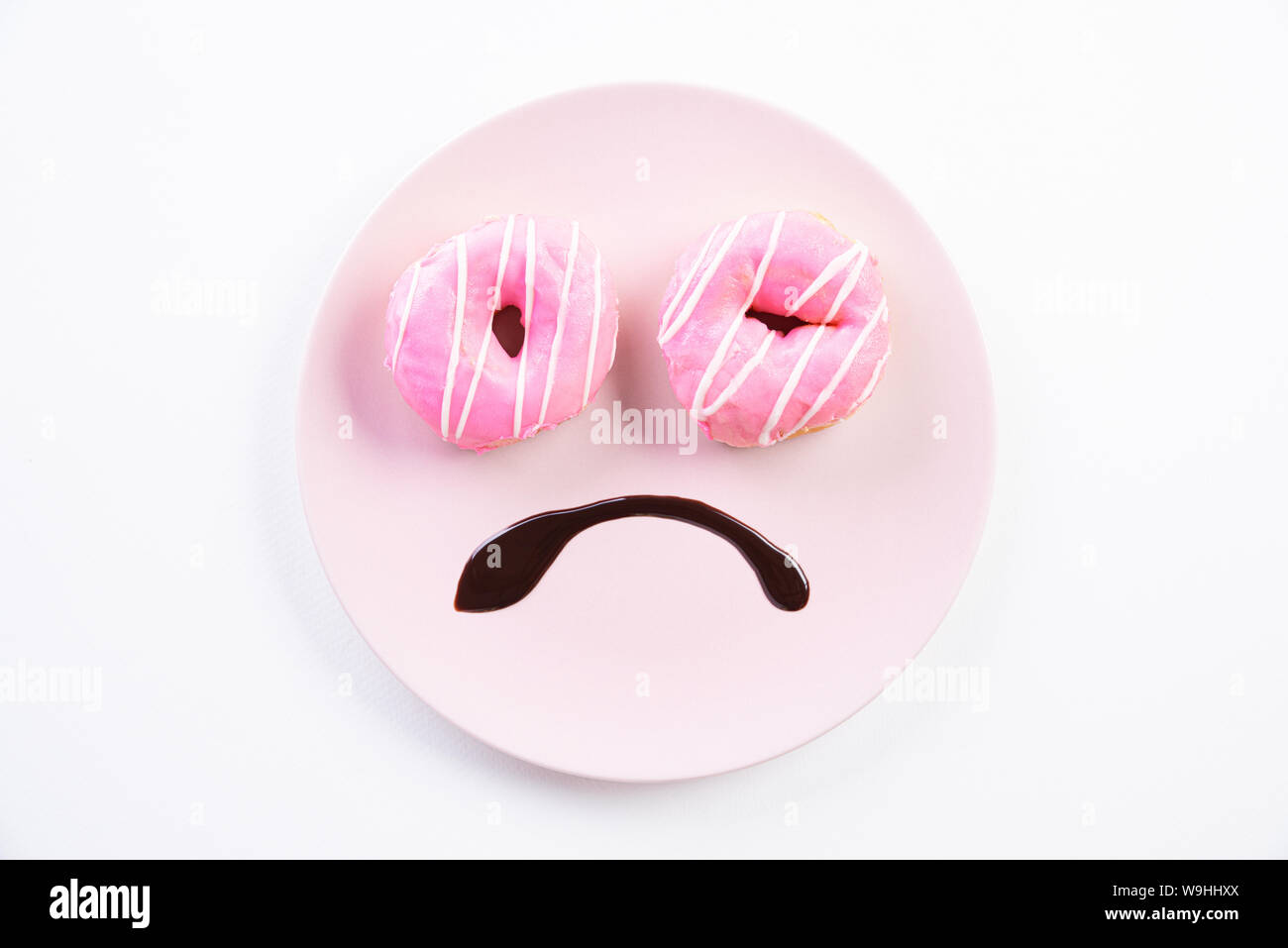 Top view of smiley sad face worried about overweight made on dish with ...