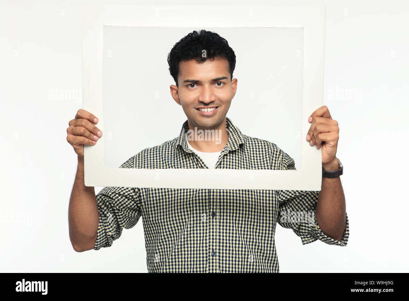 Indian man looking picture frame hi-res stock photography and images ...