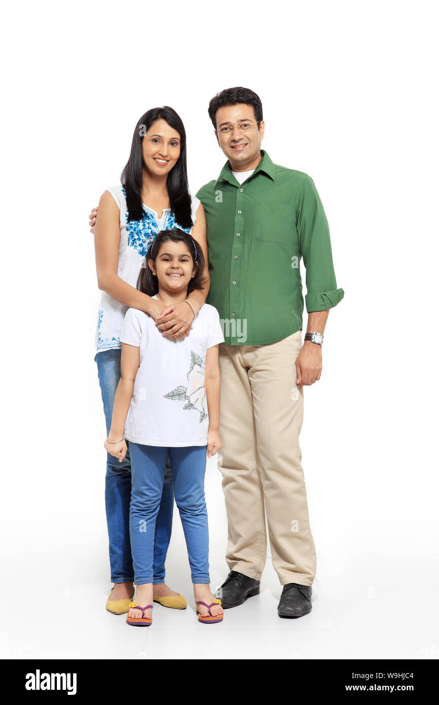 Family standing together and smiling Stock Photo - Alamy