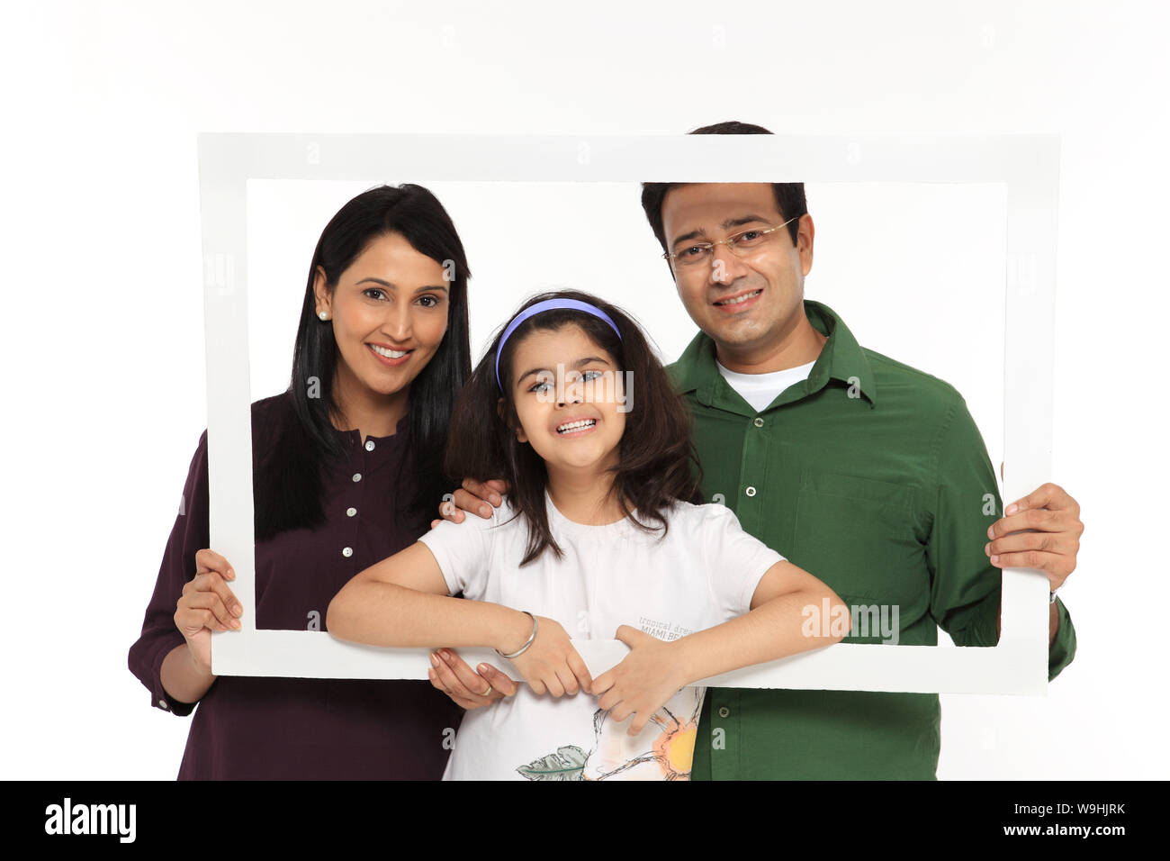 Family looking through empty frame Stock Photo - Alamy