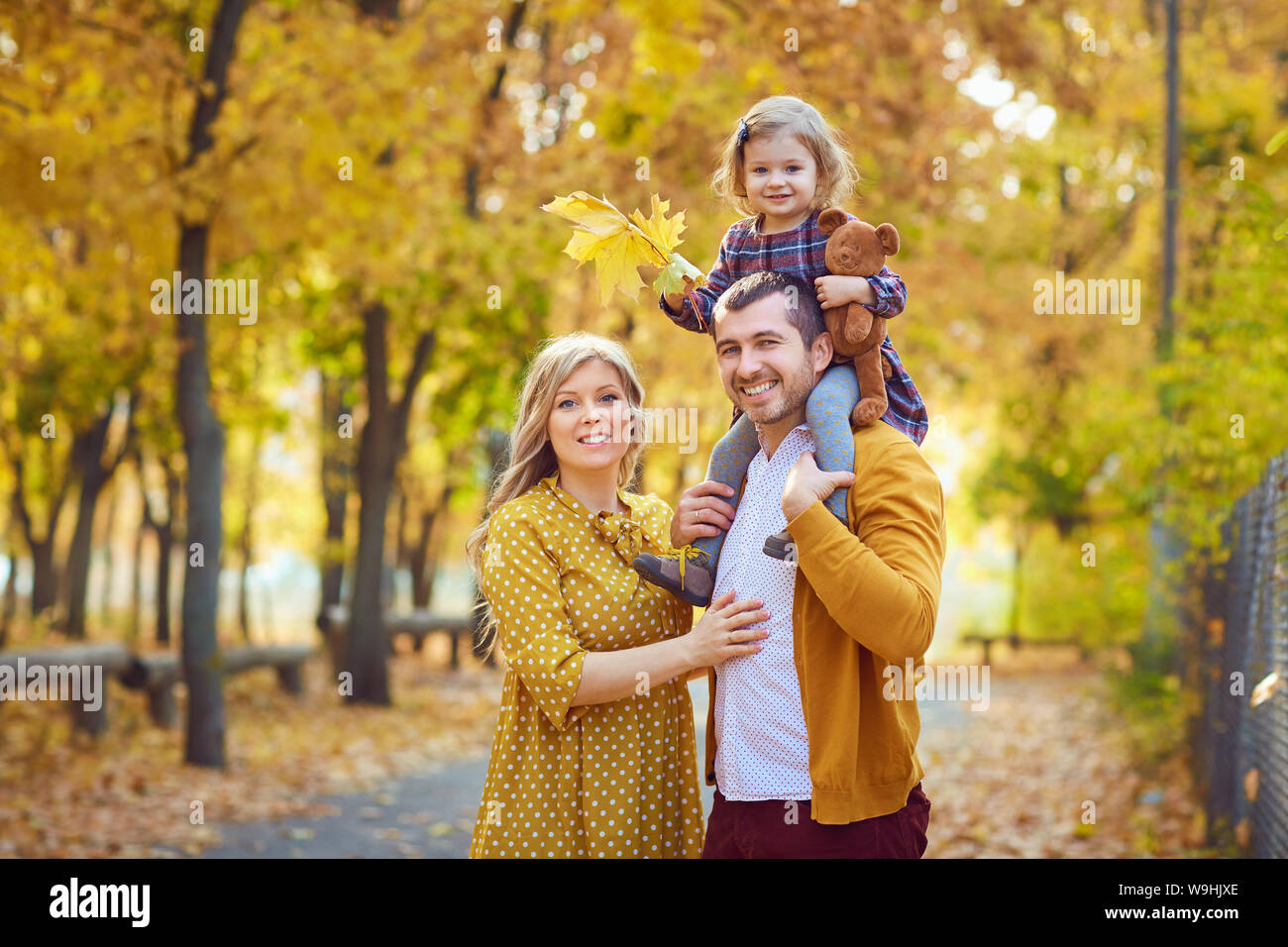 Playing woman in yellow hi-res stock photography and images - Alamy
