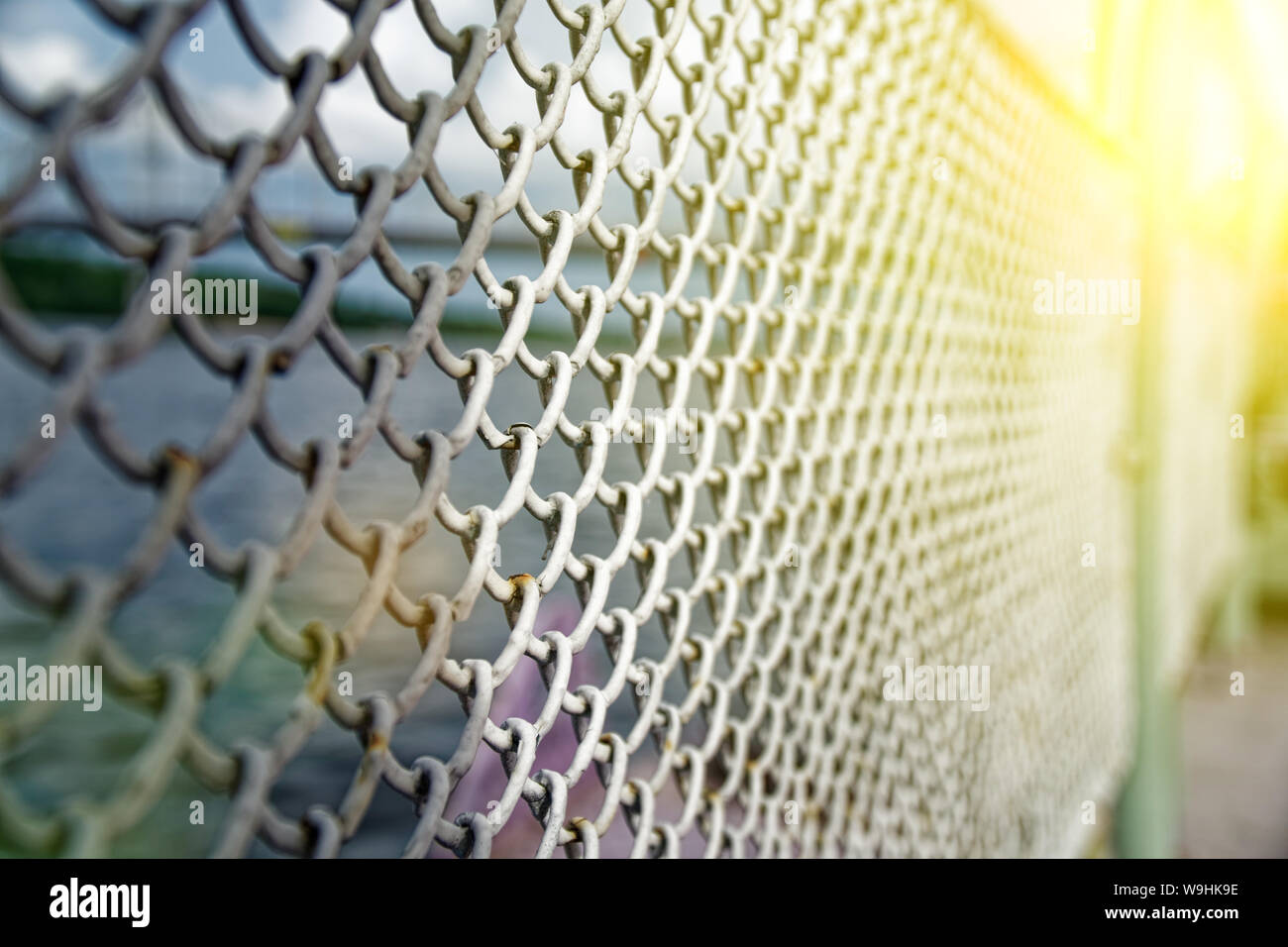 Mesh cage fence with wire behind, marine concept Stock Photo - Alamy