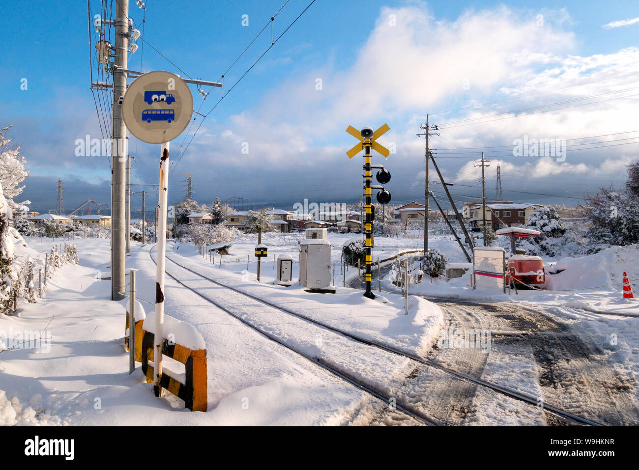 Railway track for local train with white snow fall in winter season ...
