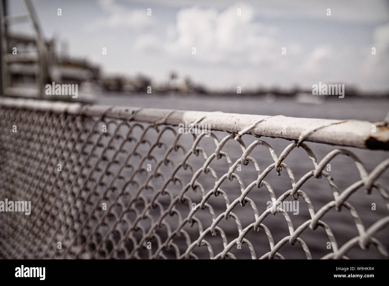 Mesh cage fence with wire behind, marine concept Stock Photo - Alamy