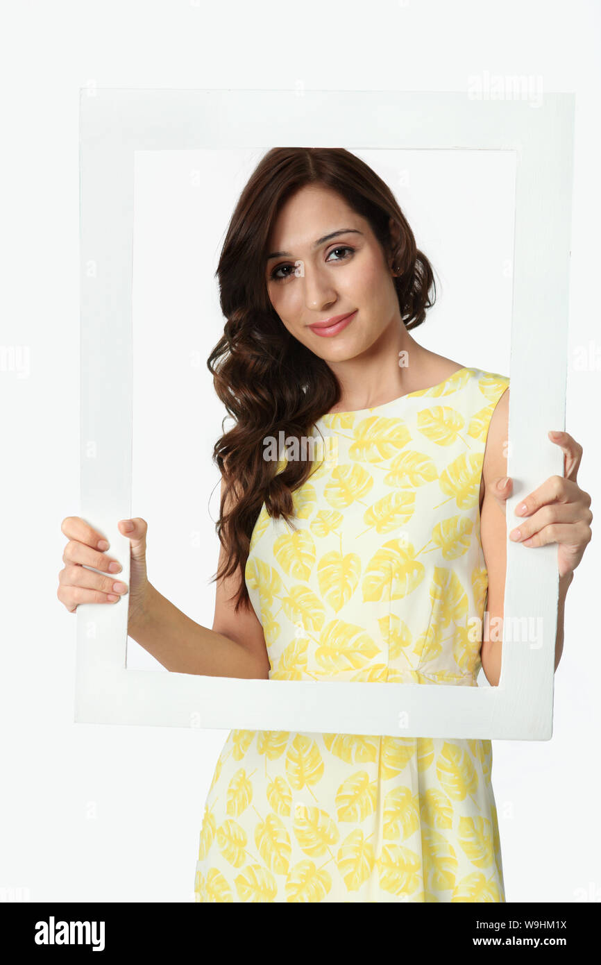 Young woman framing herself Stock Photo - Alamy