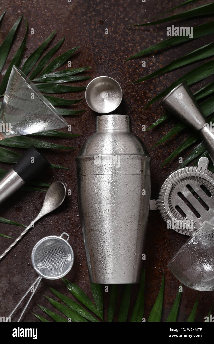 cocktail shaker on the background of fruits and tropical leaves Stock ...