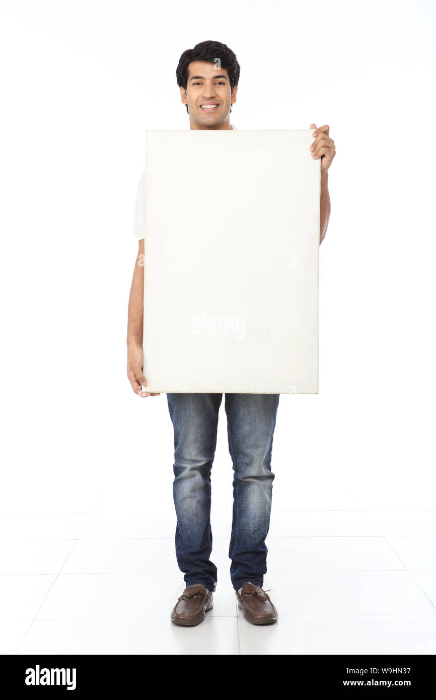 Indian man showing placard smiling hi-res stock photography and images ...