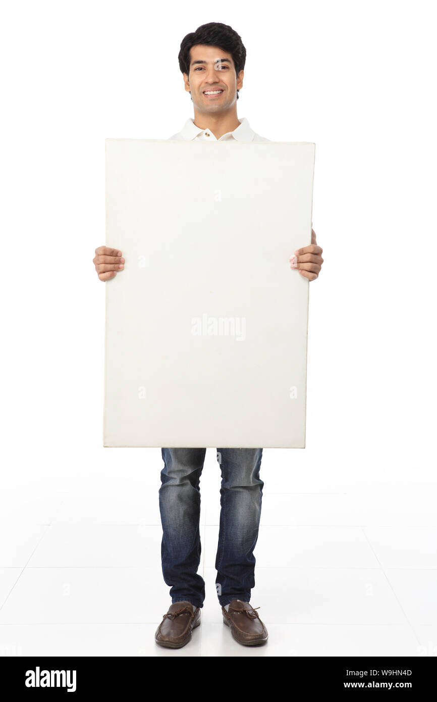 Indian man showing placard smiling hi-res stock photography and images ...
