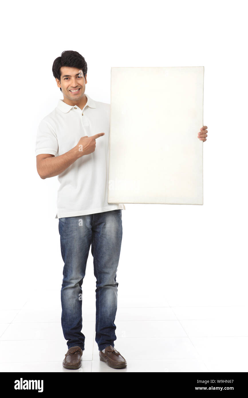 Man showing a placard and smiling Stock Photo - Alamy