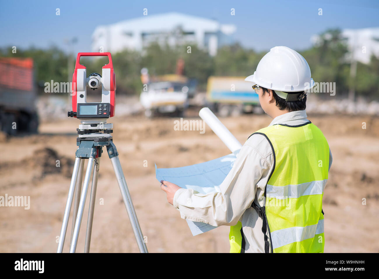 Construction engineer checking construction drawing at site area for ...