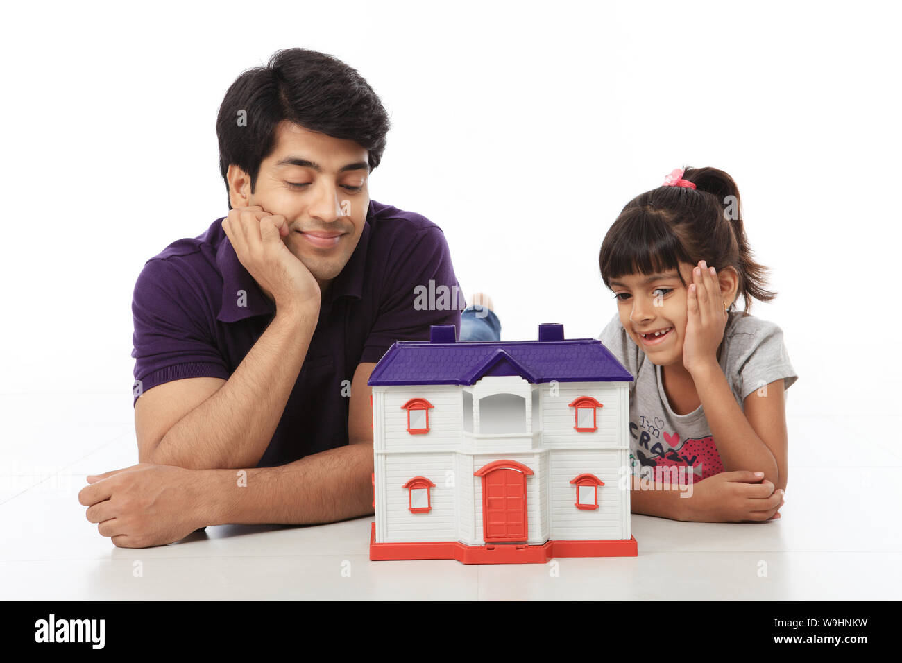 Father with his daughter looking at dream home Stock Photo - Alamy