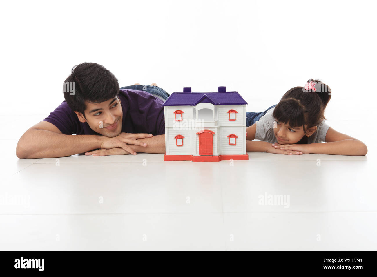 Father with his daughter looking at dream home Stock Photo - Alamy