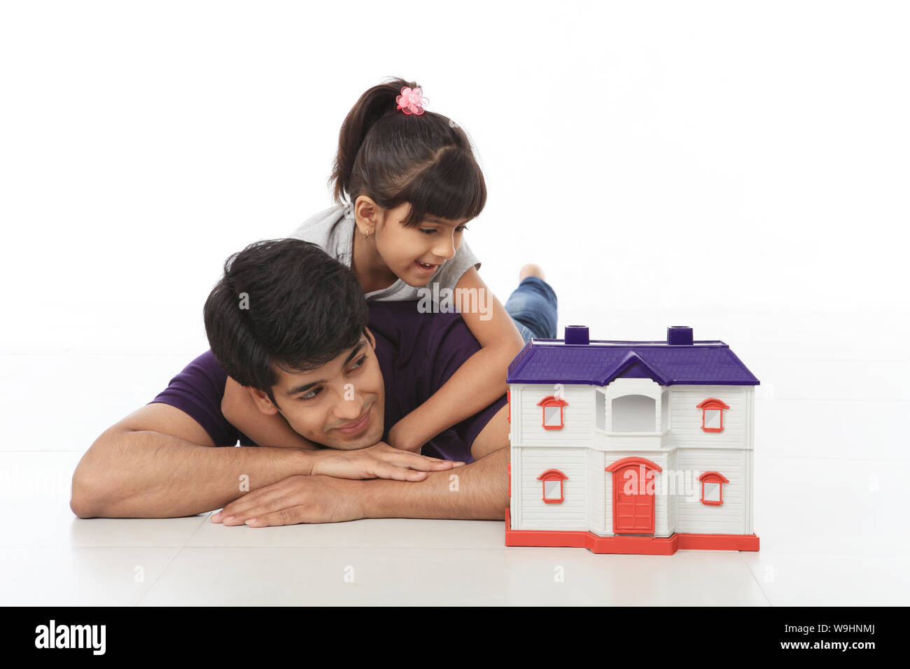 Father with his daughter looking at dream home Stock Photo - Alamy
