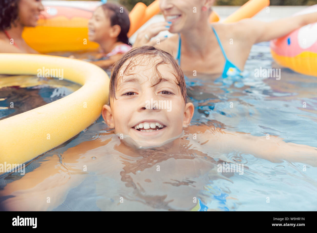 Boy swimming in pool Stock Photo - Alamy