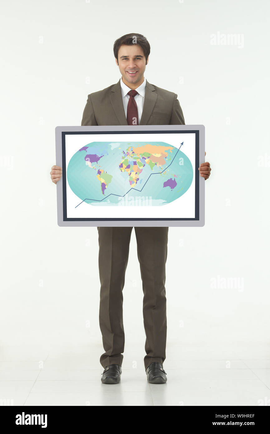 Businessman holding a world map Stock Photo - Alamy