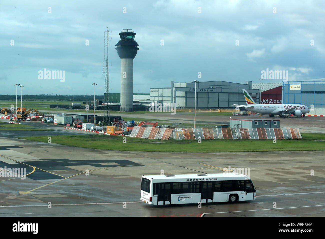 Baggage handlers on the runway at terminal one manchester airport hi ...