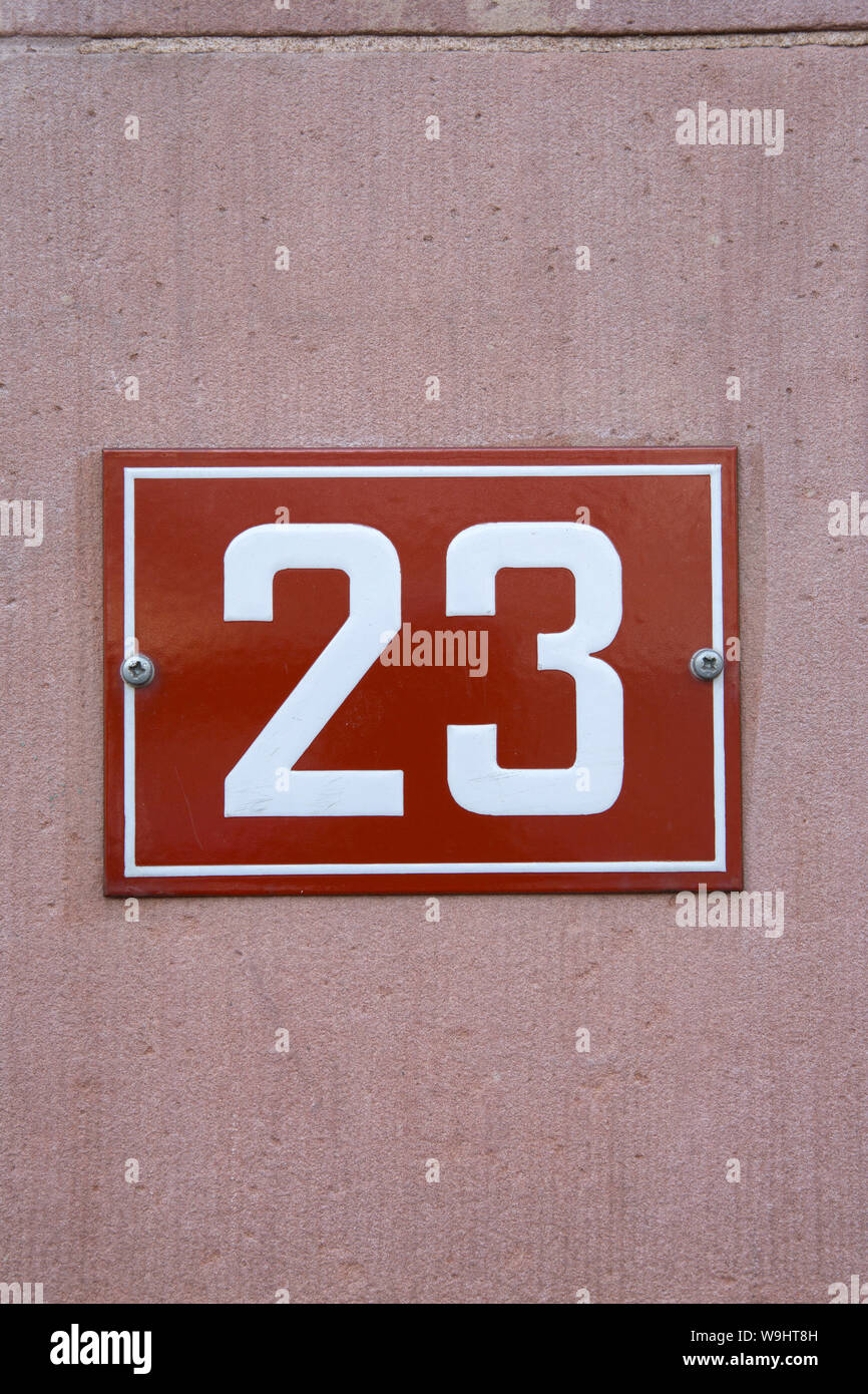 Red Number Twenty-Three on Stone Wall Stock Photo - Alamy