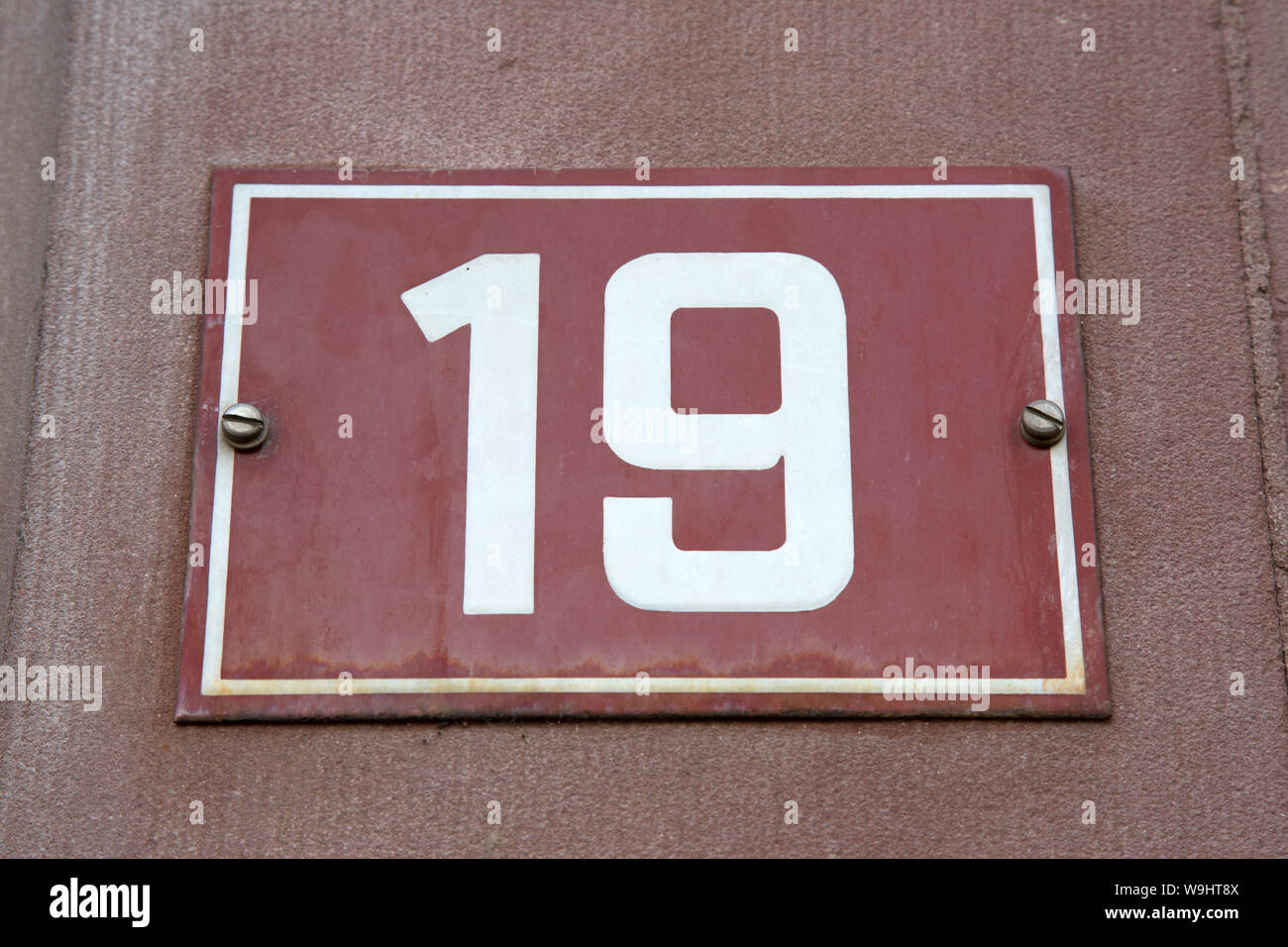 Red Number Nineteen on Stone Wall Stock Photo - Alamy