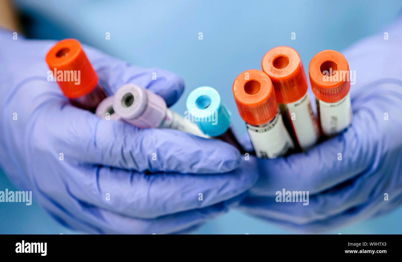 Several blood samples along with needle, conceptual image Stock Photo ...
