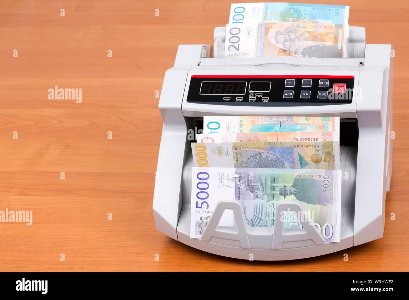 Serbian dinars in a counting machine Stock Photo - Alamy