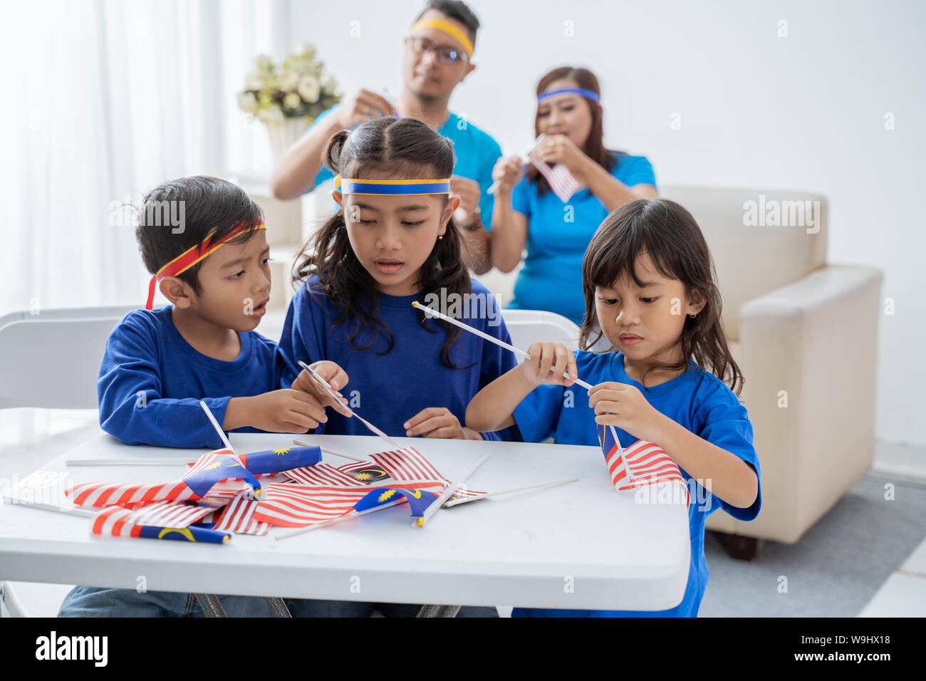 kids making malaysian flags together at home with family Stock Photo ...