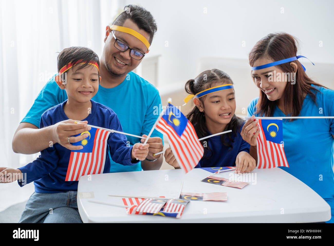 kids making malaysian flags together at home with family Stock Photo ...