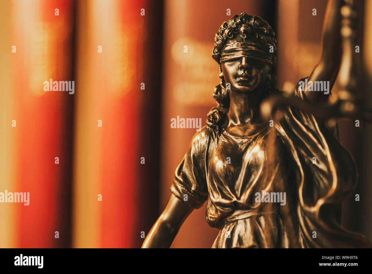 Lady Justice Figure With A Law Book In Court High Resolution Stock ...