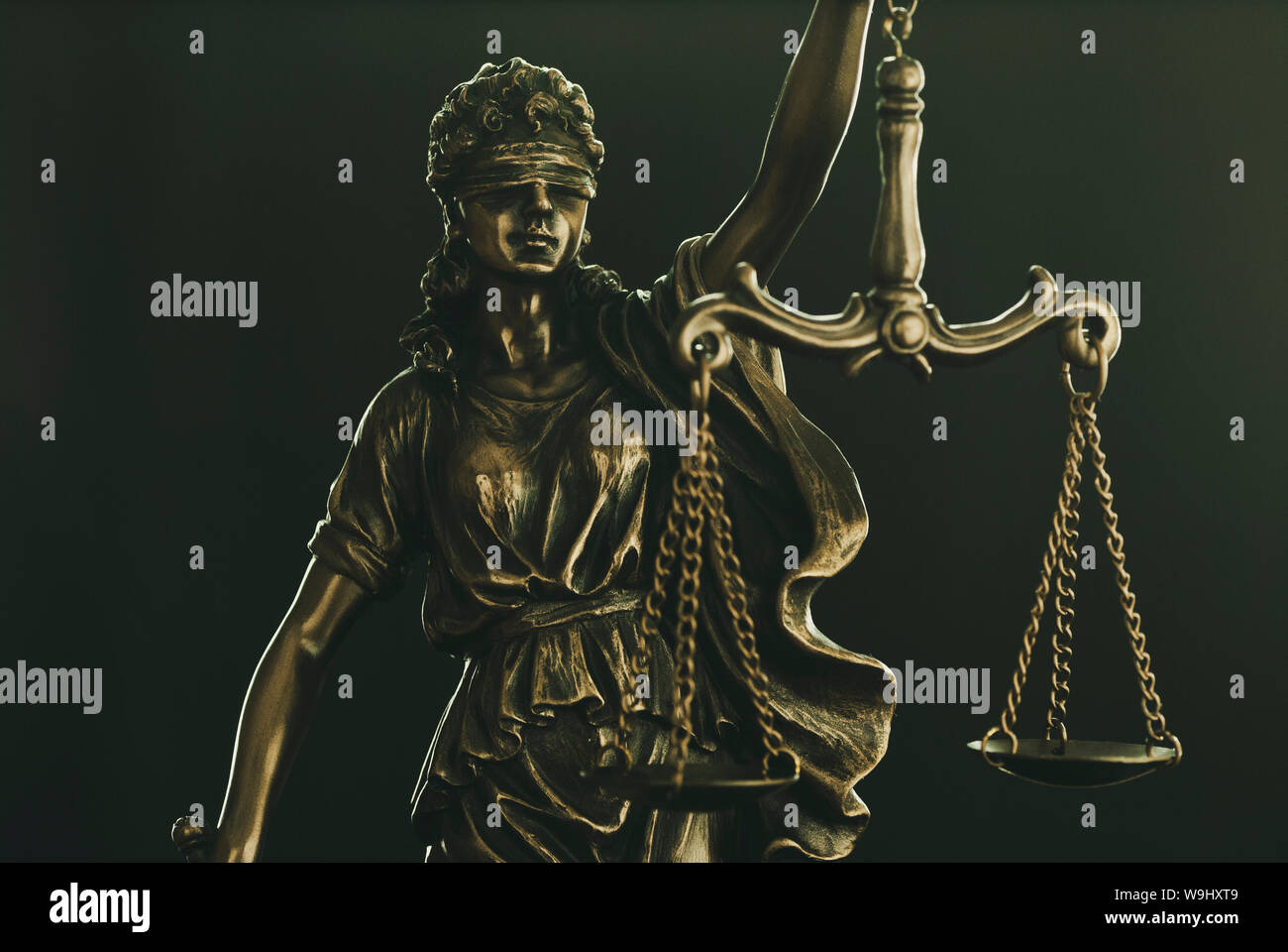 Lady justice figure with a law book in court hi-res stock photography ...