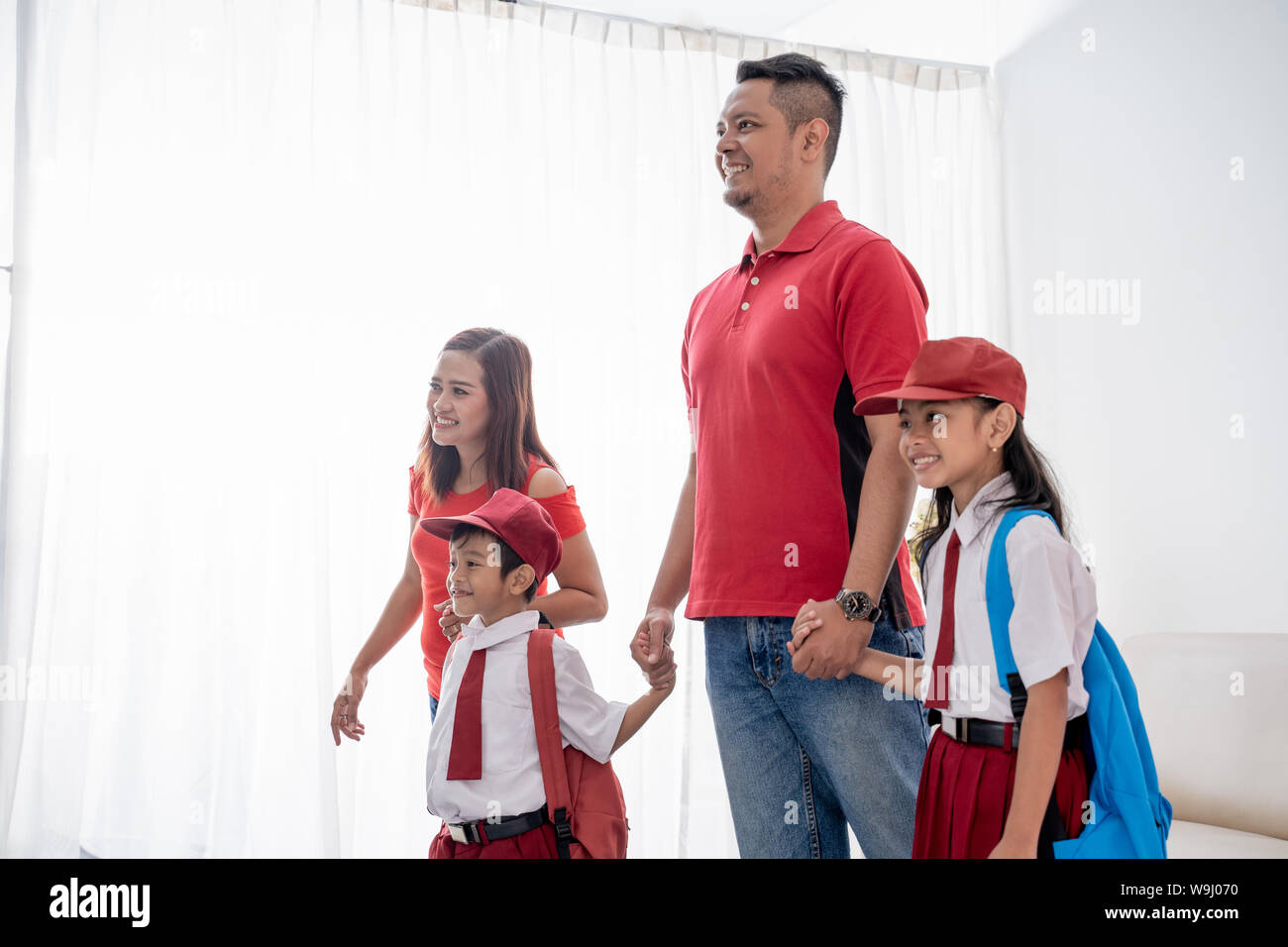 Children school home time uniform hi-res stock photography and images ...