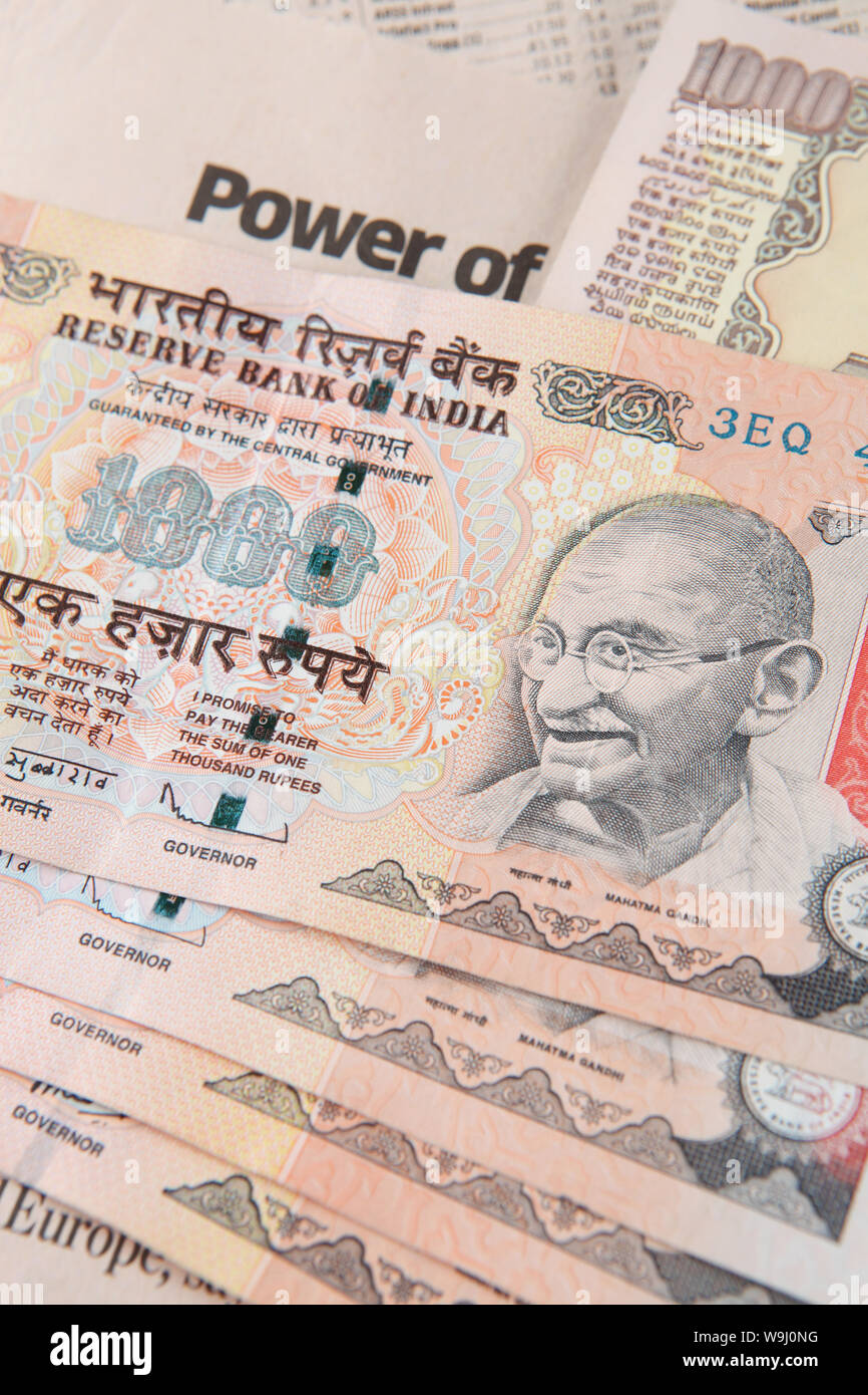 Indian banknotes on financial newspaper Stock Photo - Alamy