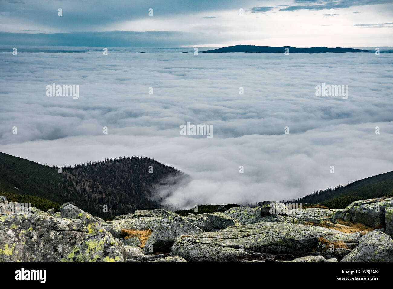 High mountains. View of the valley, many beautiful clouds below and ...