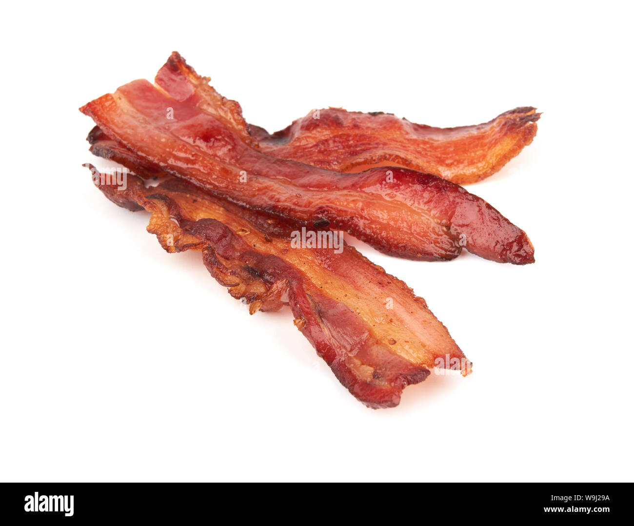 cooked slices of bacon isolated on white background Stock Photo - Alamy