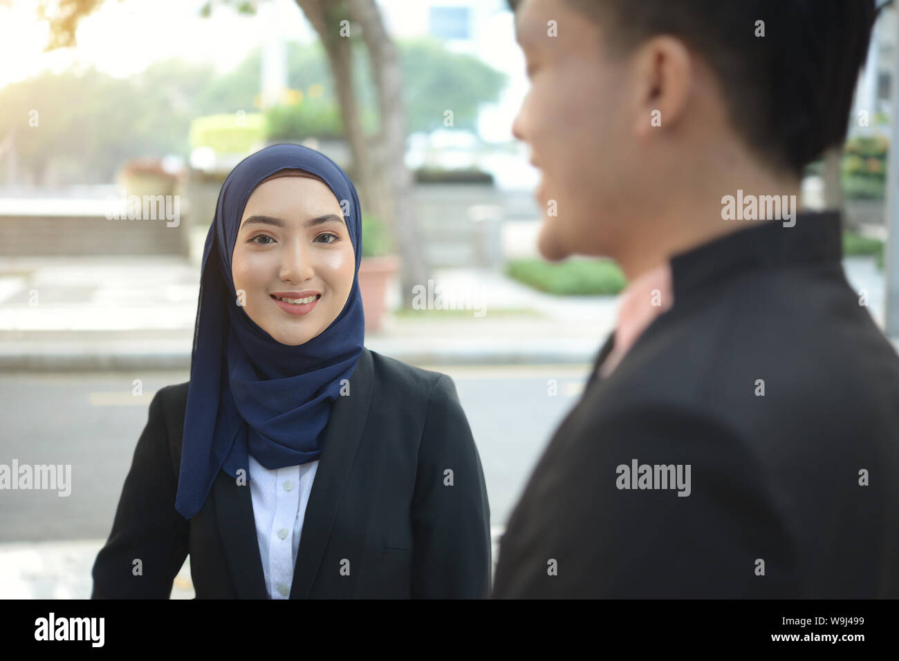 malay muslim business woman having conversation Stock Photo - Alamy