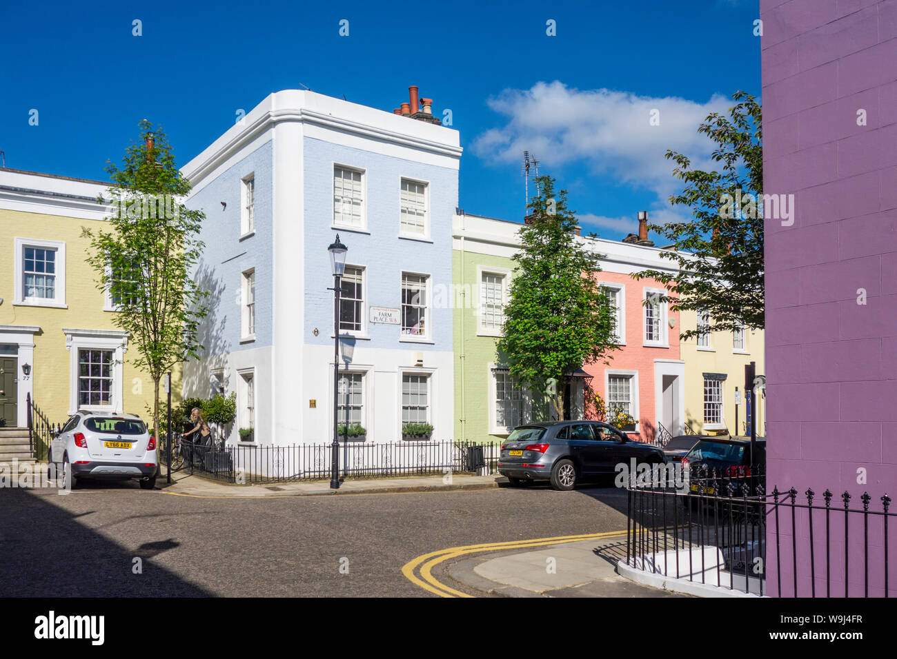 Row of colourful painted houses hi-res stock photography and images - Alamy