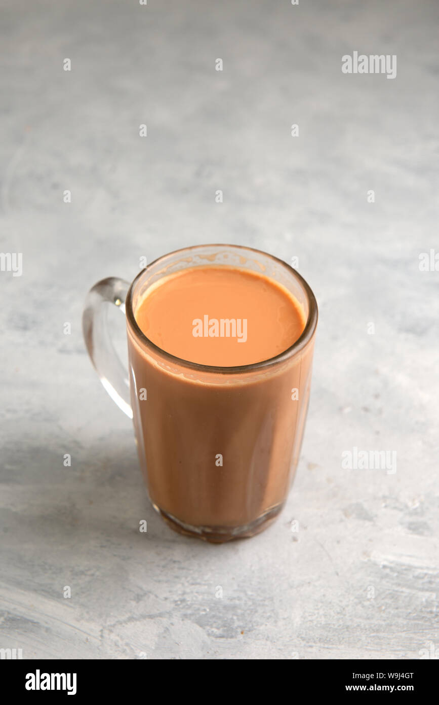 Tea with milk in a mug or popularly known as Teh Tarik on white ...