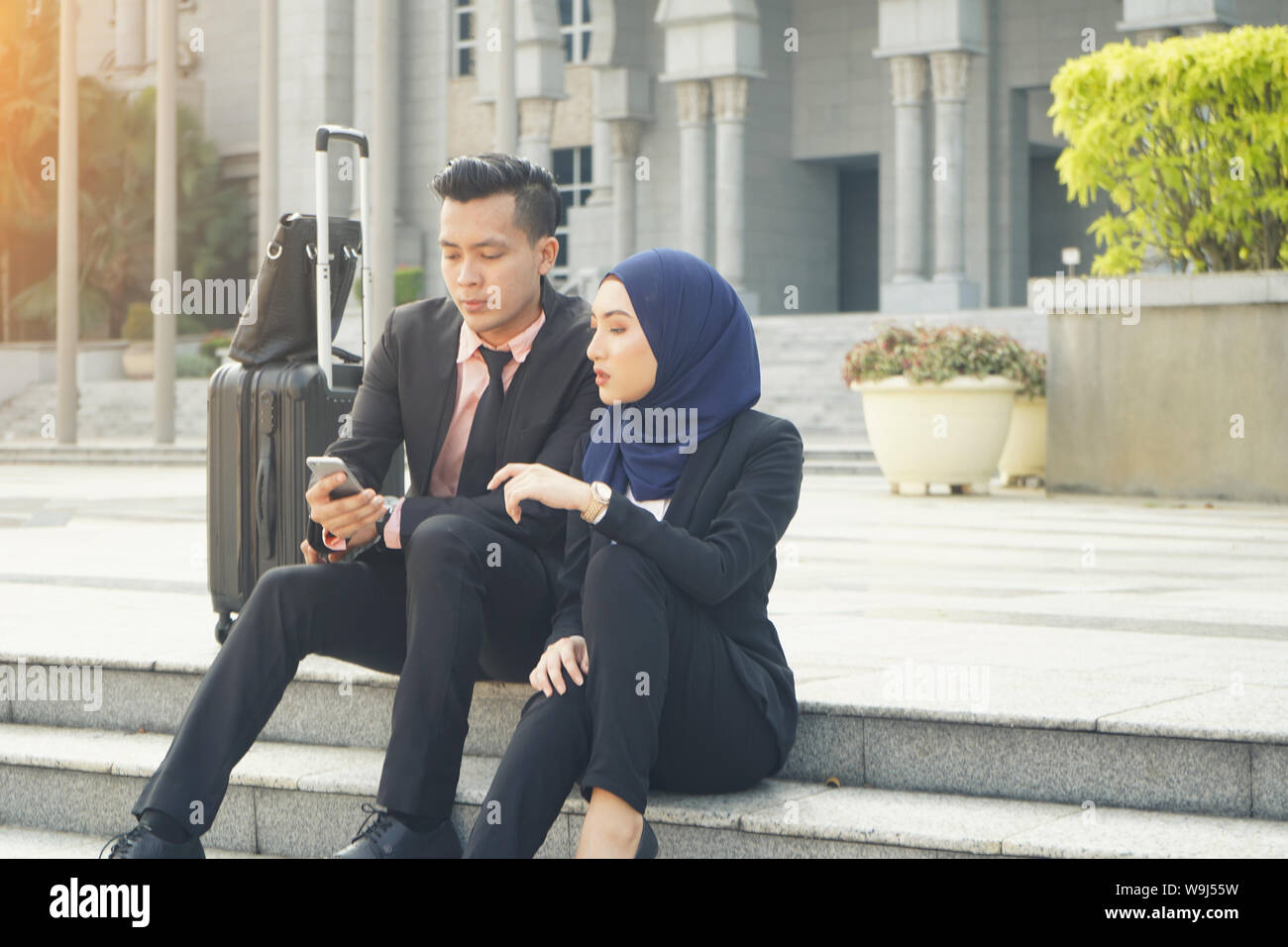 malay muslim woman and male business team Stock Photo - Alamy
