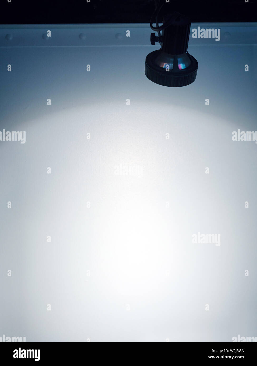 Spotlights on the white wall Stock Photo - Alamy