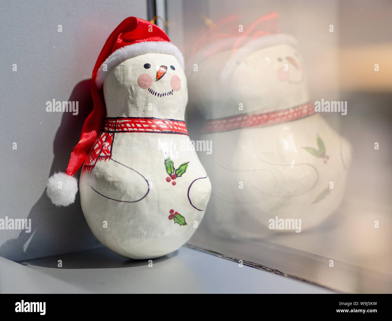 Snowman by the window Stock Photo - Alamy
