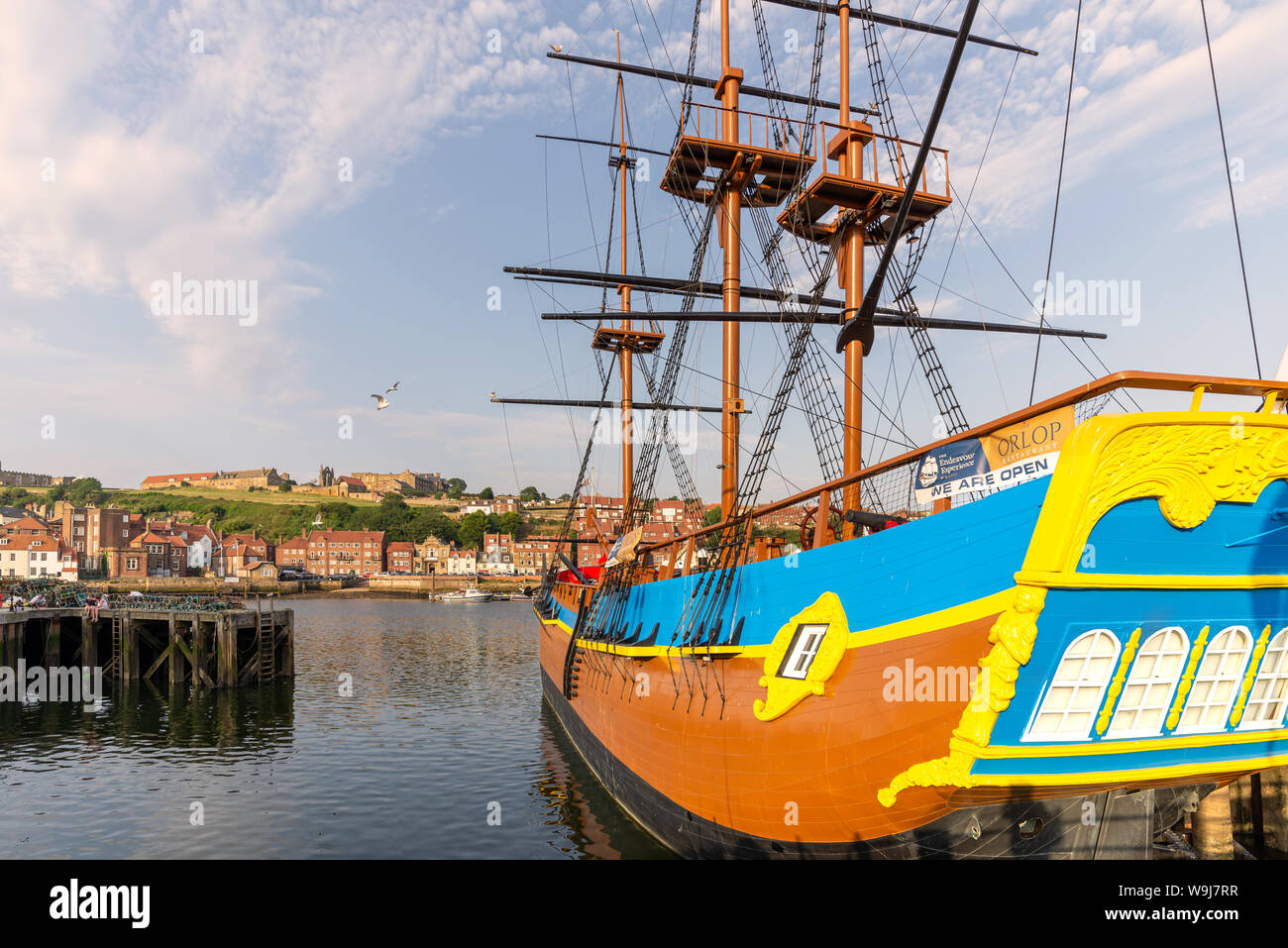 A replica of HMS Endeavour moored in Whitby Harbour. There are lobster ...