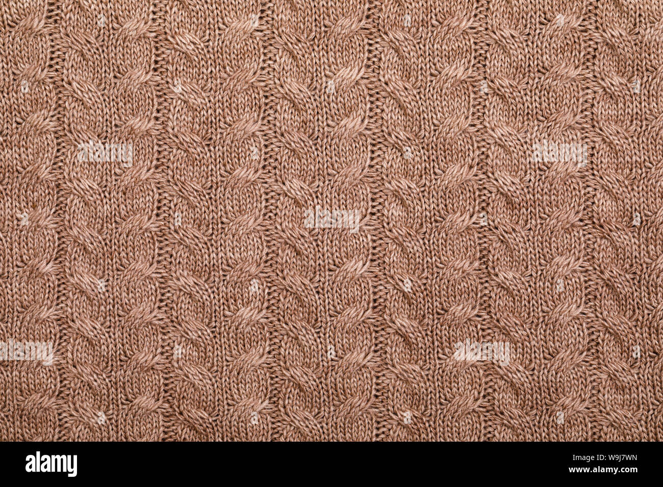 Real brown knitted fabric with cable pattern textured background Stock ...
